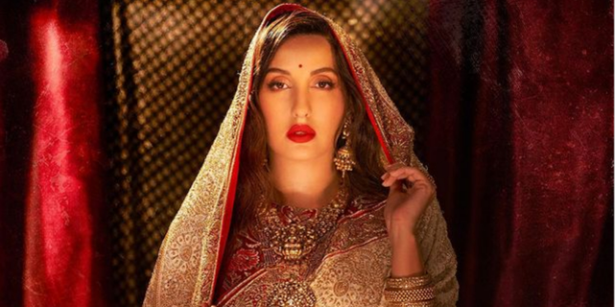 WATCH: Nora Fatehi Looks tempting in Red Saree as she uploaded